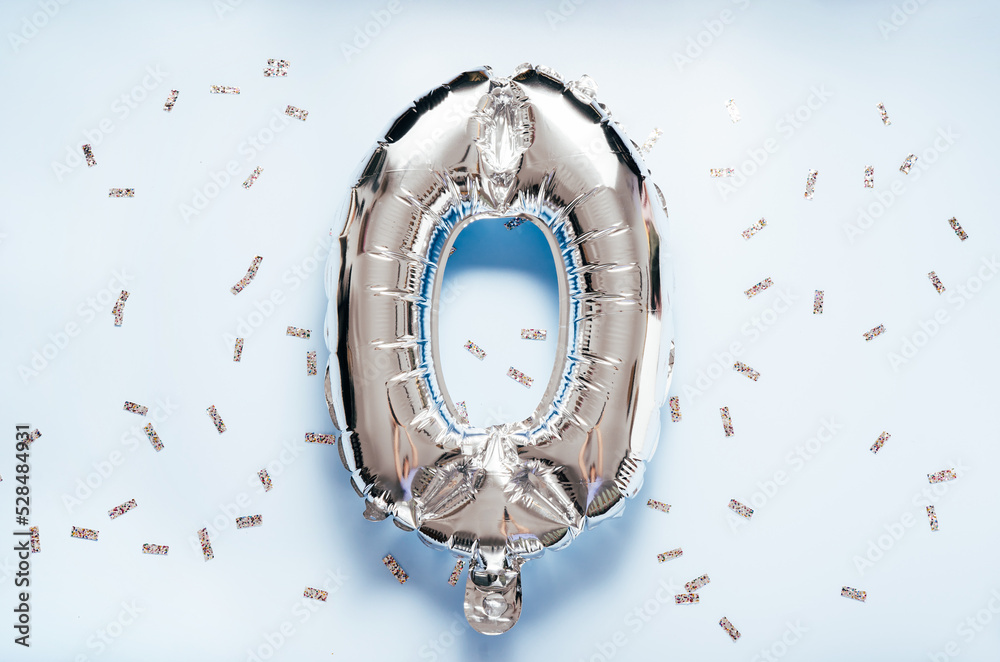 Silber balloon number 0 on light glitter background for your desing ...