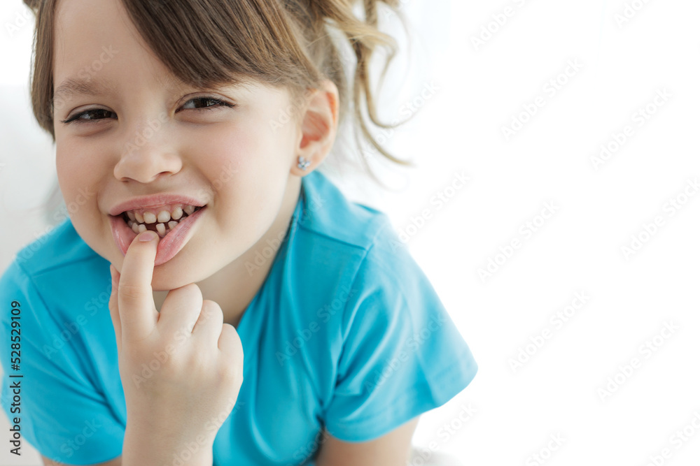 The child has lost a tooth. Little girl without a tooth. The first ...