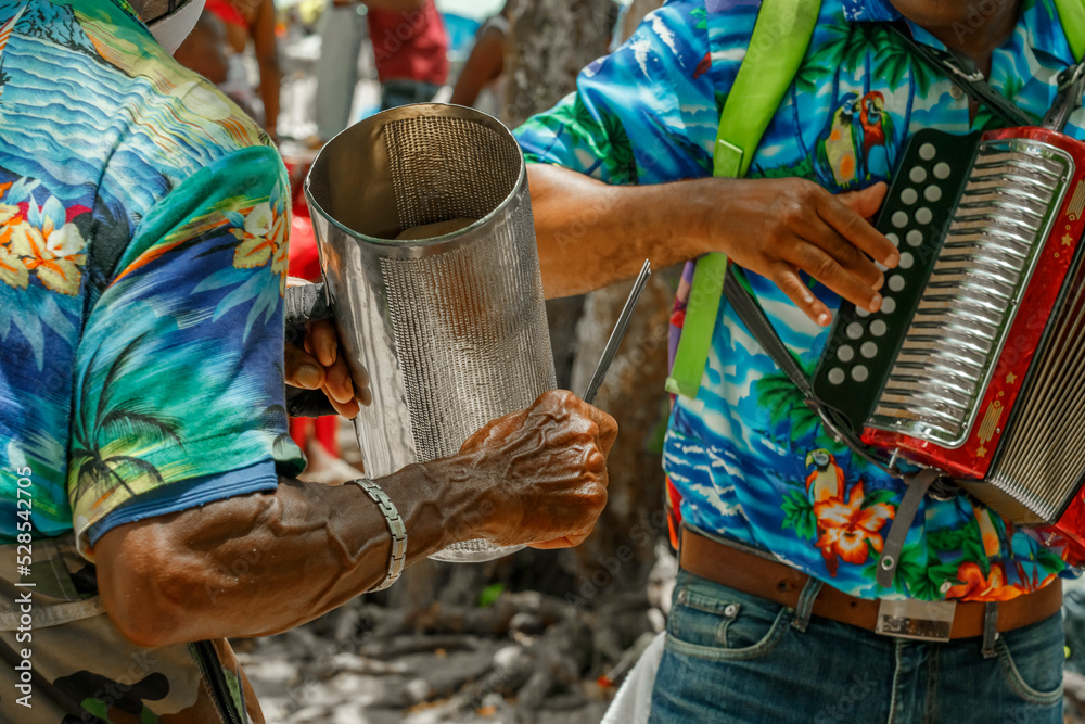 Dominican Republic. Beach musicians. Merengue music. Playing the ...