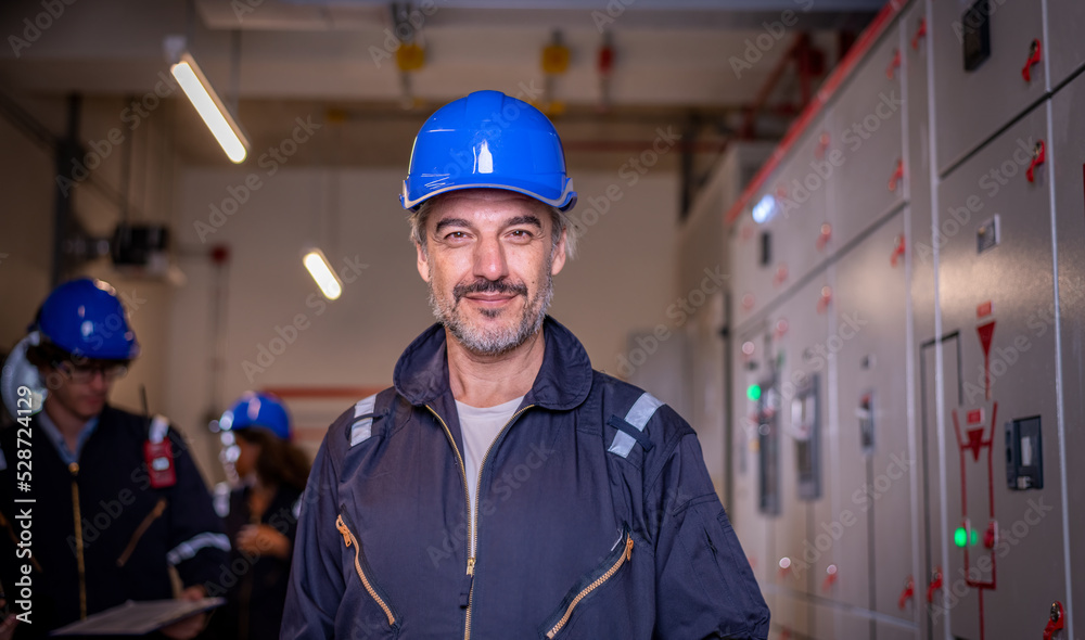 Foto de Stock The engineer checking and inspecting at MDB panel .he ...