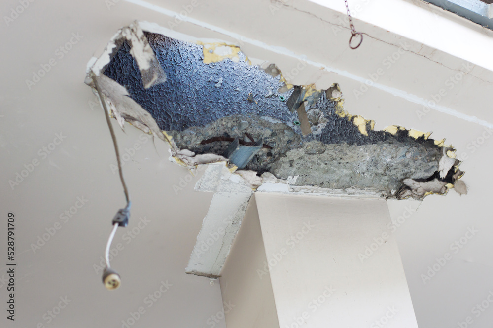Ceiling panels damaged hole in the roof office from drain pipes water ...