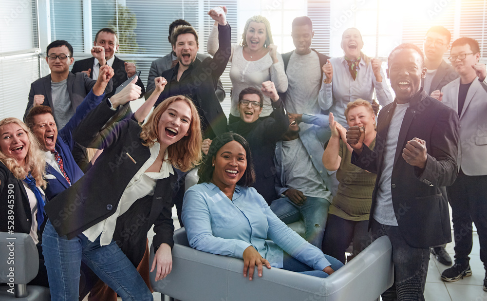 happy team of diverse corporate employees in the office lobby. Stock ...