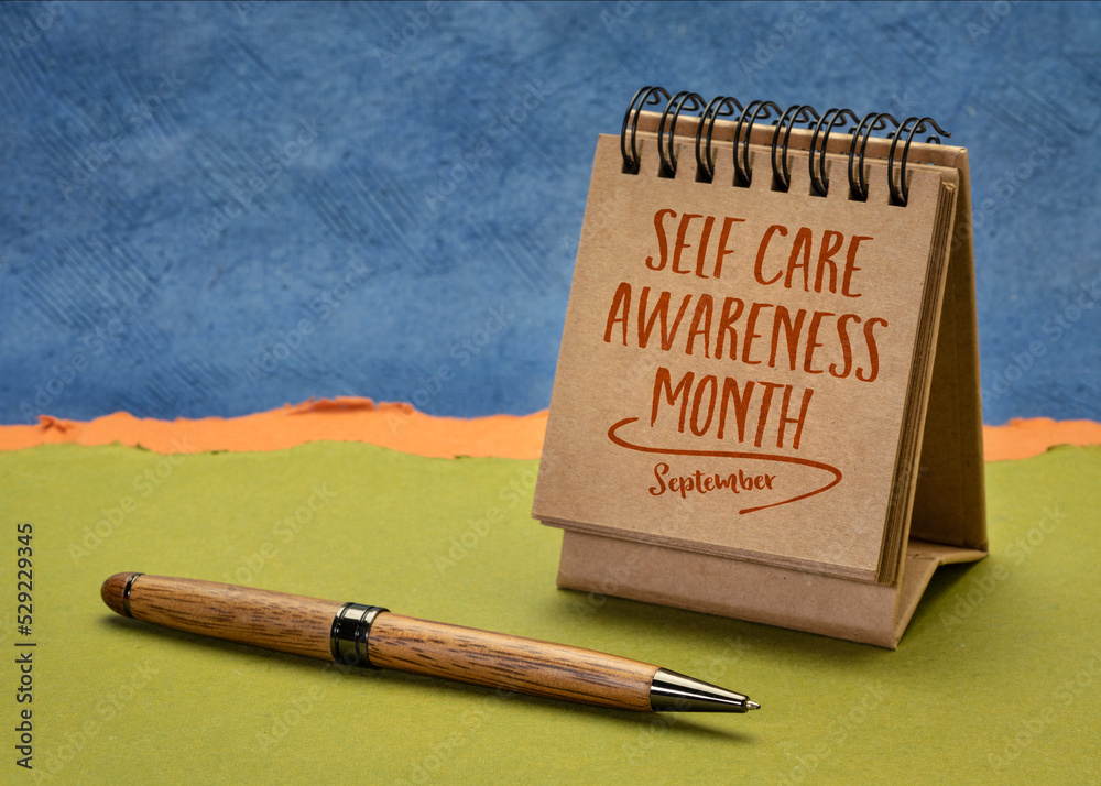 Self Care Awareness Month, September - handwriting in a small desktop ...