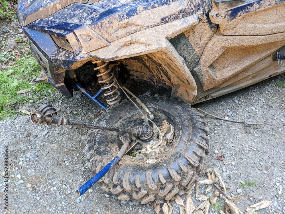 Crashed four wheeler with broken axle Stock Photo | Adobe Stock