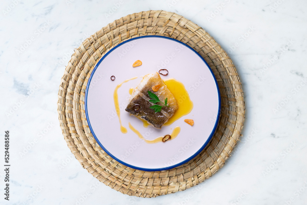 Bacalao al pil pil traditional tapa from the north of Spain. Coconut ...