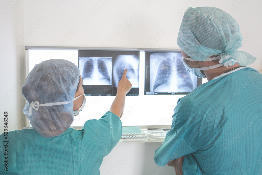 pulmonologist Doctor with his nurse looks at a chest x-ray Stock Photo ...