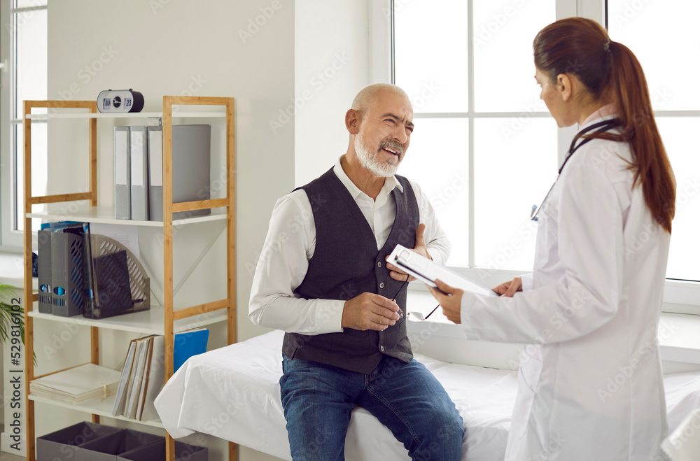 Patient visits doctor. Worried senior citizen speaks about weak heart ...
