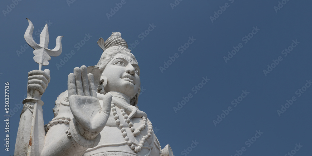 Four-armed Lord Shiva with a trident and a cobra around his neck. Lord ...