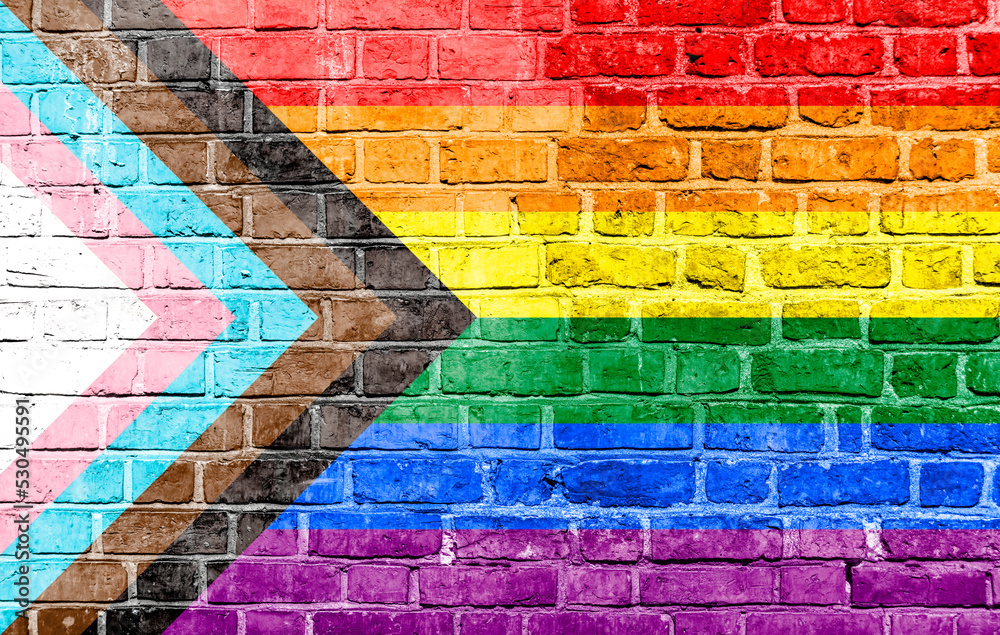 Progress LGBTQ rainbow flag waving in the wind at cloudy sky. Freedom ...