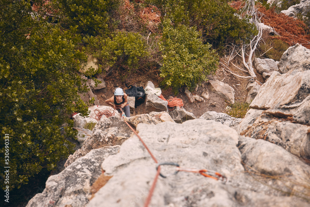 Climbing, abseiling and adventure with a woman climber hiking on a ...