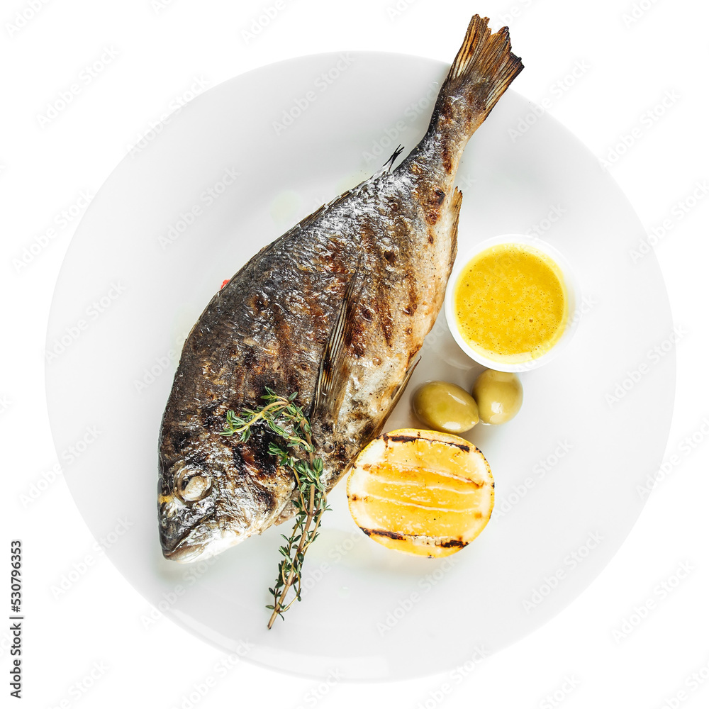 Plate of gourmet grilled dorada fish Stock Photo | Adobe Stock