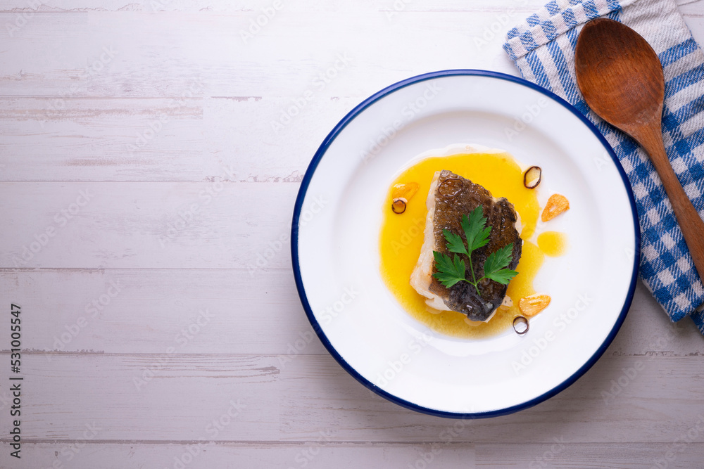 Bacalao al pil pil traditional tapa from the north of Spain. Coconut ...