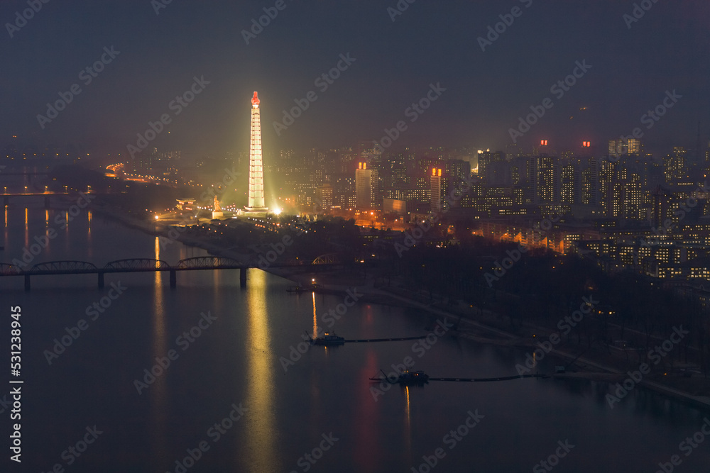 Pyongyang city skyline at night, Juche Tower and Taedong River ...