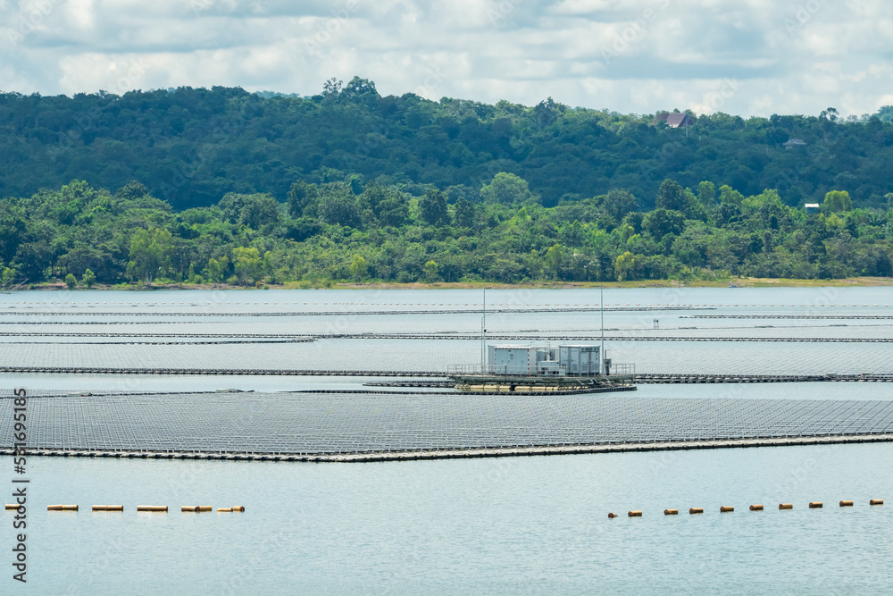 Floating solar farm or floating photovoltaics. Solar power. Landscape of solar panels floating ...