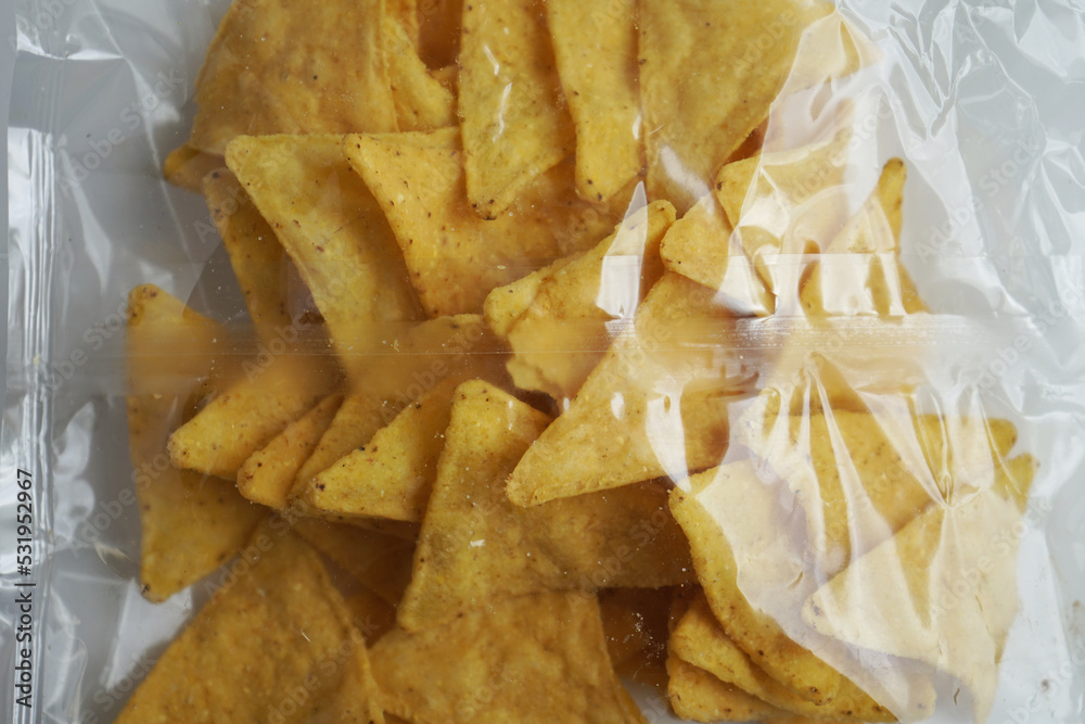 Tortilla mexican corn chip in transparent single use plastic bag on ...