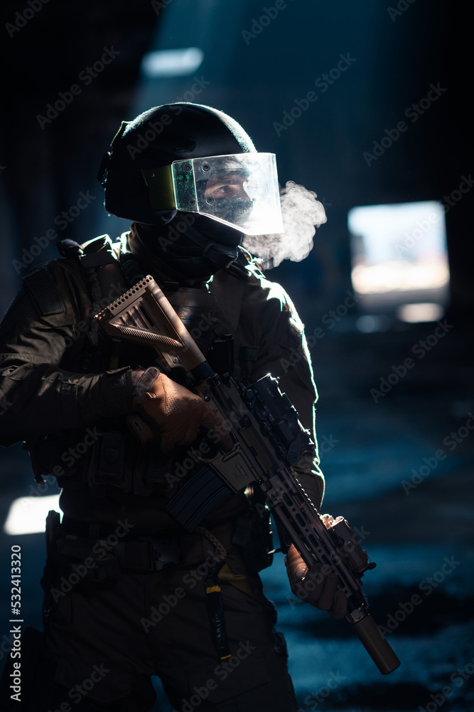 Army soldier in Combat Uniforms with an assault rifle and combat helmet ...
