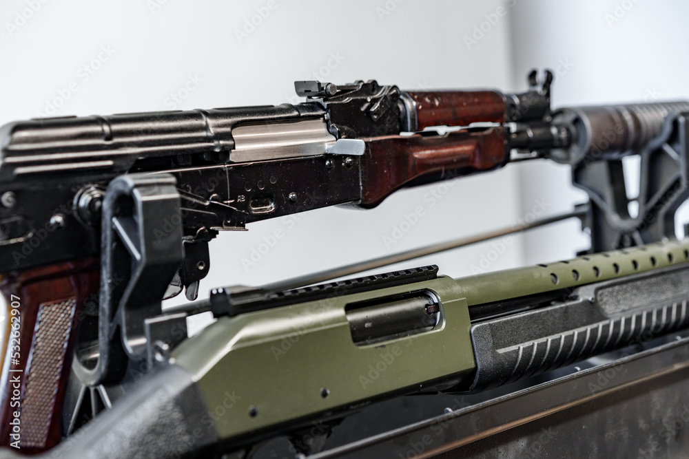 Automatic rifle on stand on the table of the weapons workshop. Stock ...