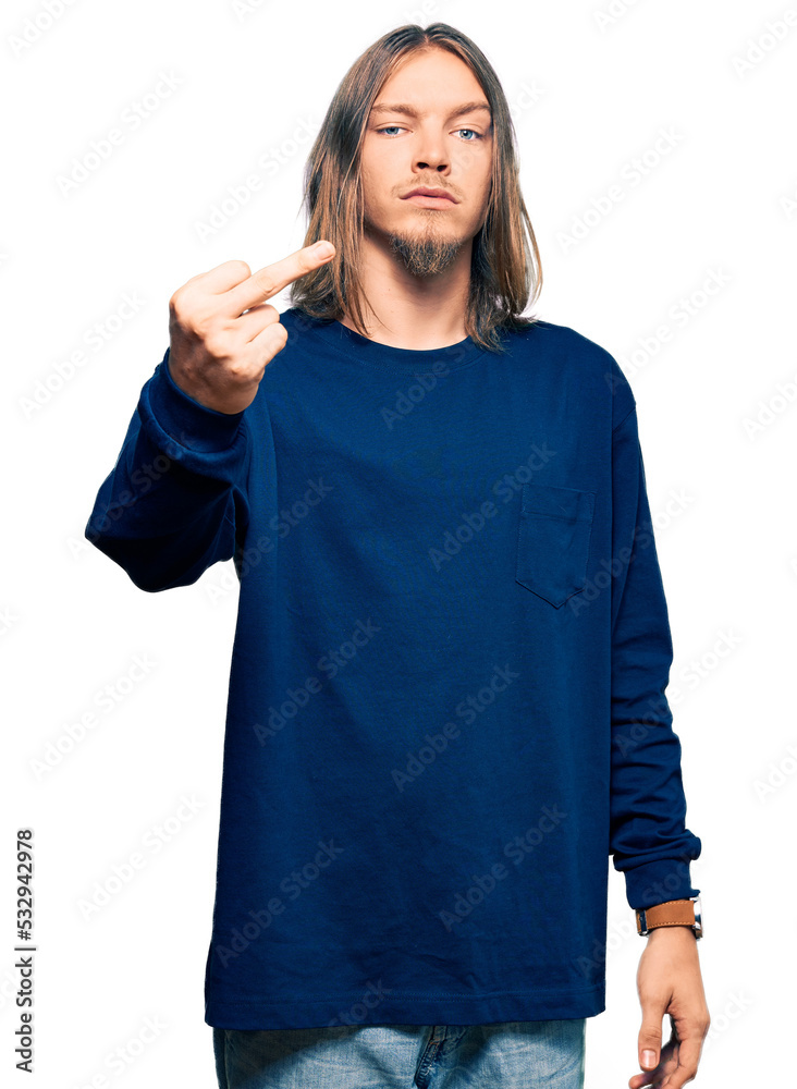 Handsome caucasian man with long hair wearing casual winter sweater ...