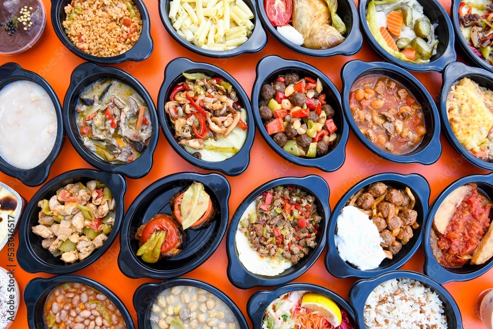 Table scene of assorted take out or delivery foods. Traditional Turkish ...