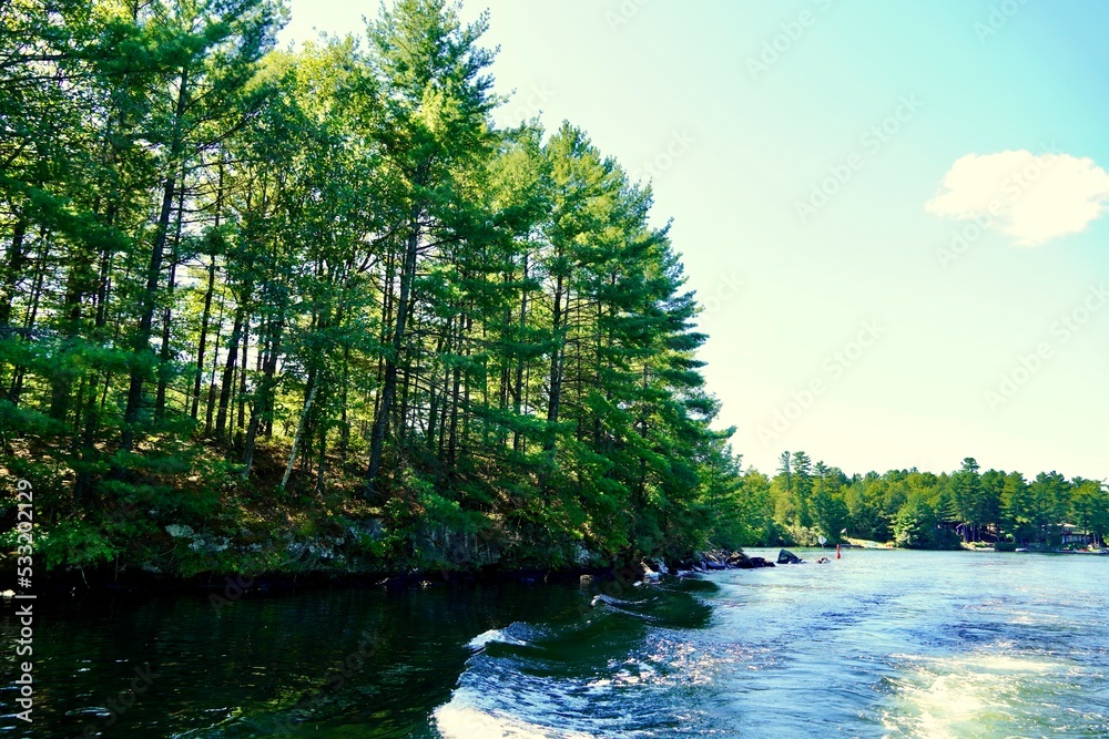 Boating in the Trent Severn Waterway with morning sun shining through ...