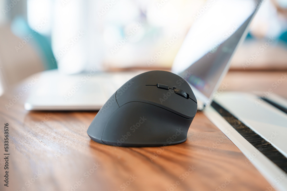 ergonomic mouse on desk at workplace, prevention wrist pain because ...
