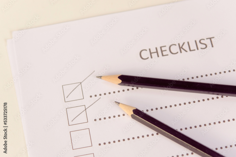 Checklist concept - checklist form paper and pencil on white table ...