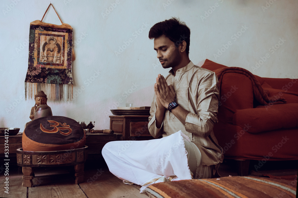 Peaceful Indian man praying to God with traditional clothes Stock Photo ...