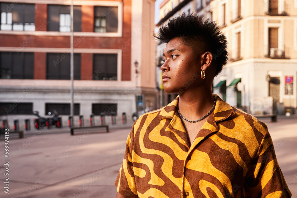 Non binary Filipino person looking away Stock Photo | Adobe Stock
