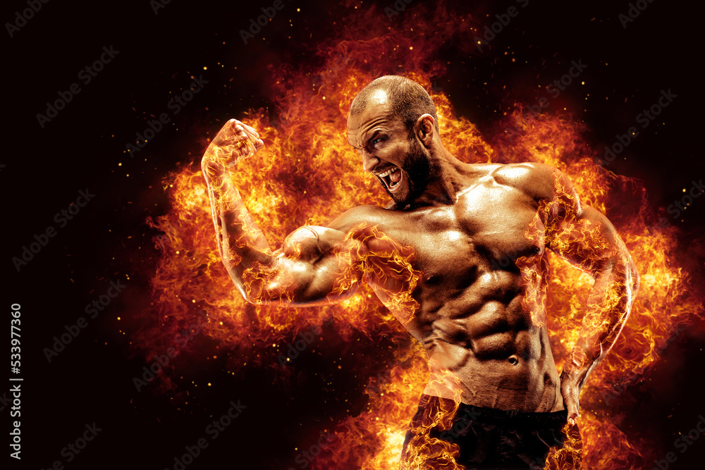 Bodybuilder posing on the fire flames background Stock Photo | Adobe Stock