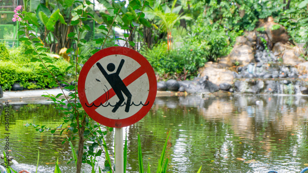 Beware of drowning sign. Forbidden to swim symbol. Deep water risk of ...