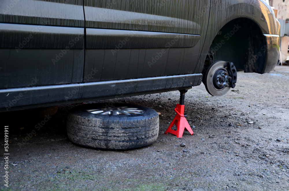 replacement of a brake disc in a car in domestic conditions. the auto ...