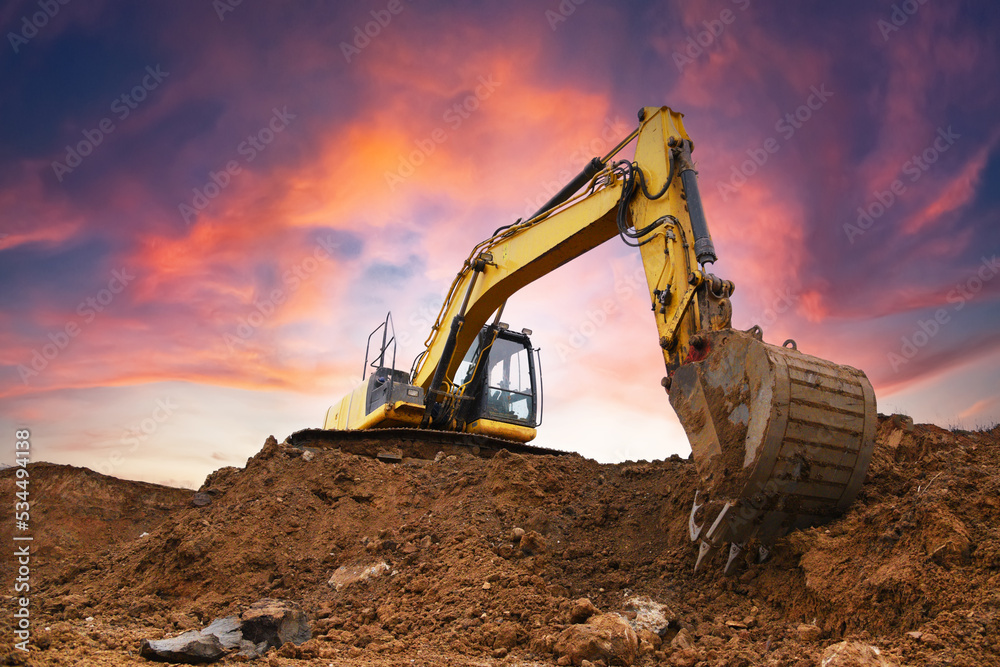 Excavator in open pit mining. Excavator on earthmoving on sunset ...