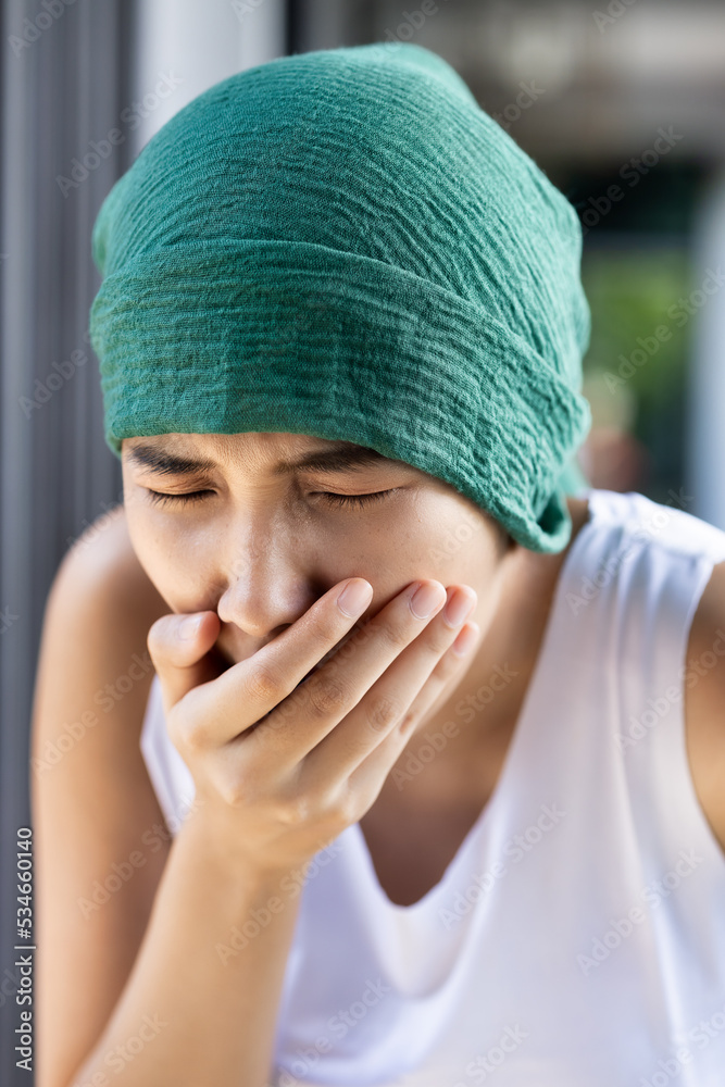woman cancer patient suffering from radiation nausea and vomiting ...