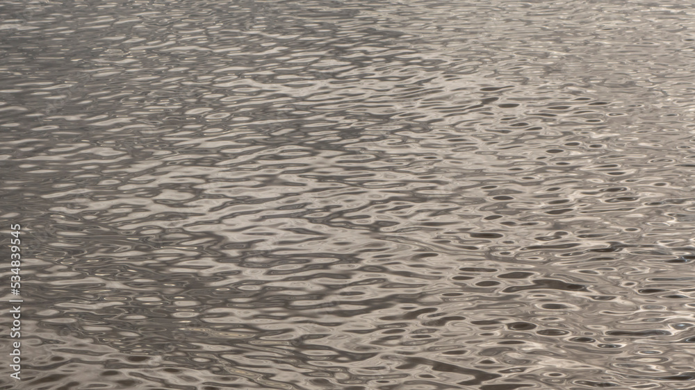 Gray water background with small ripples on the surface. Stock Photo ...