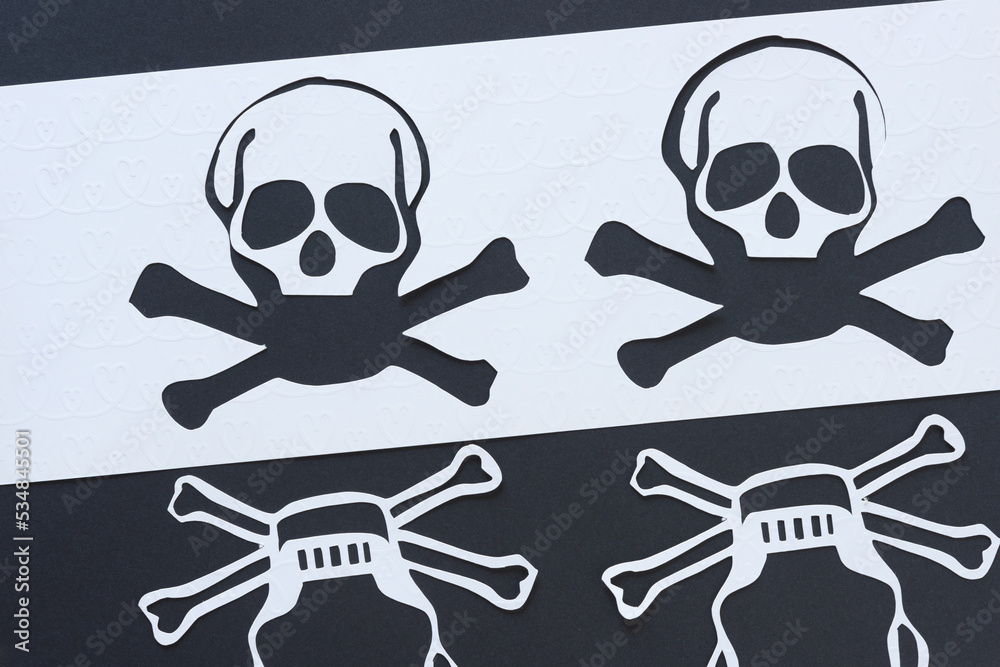 skull and crossbones on black paper (stencil) Stock Photo | Adobe Stock