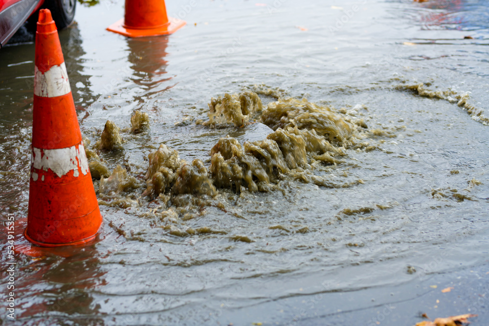 Sewage overflow onAccident sewerage system,Close-up of a flooded street ...