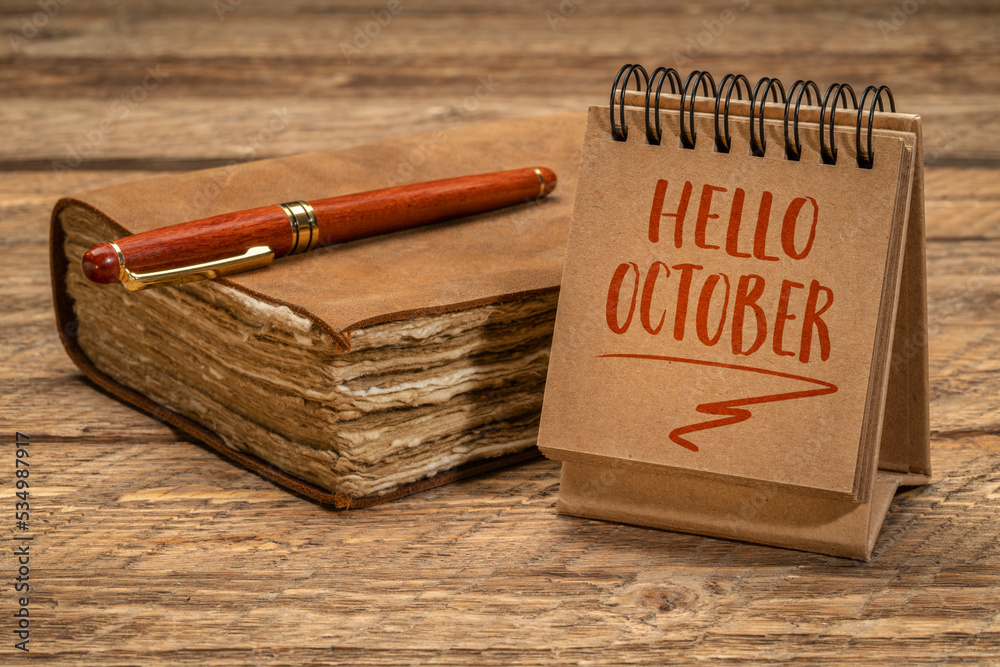Hello October welcome note - handwriting in a spiral desktop calendar ...