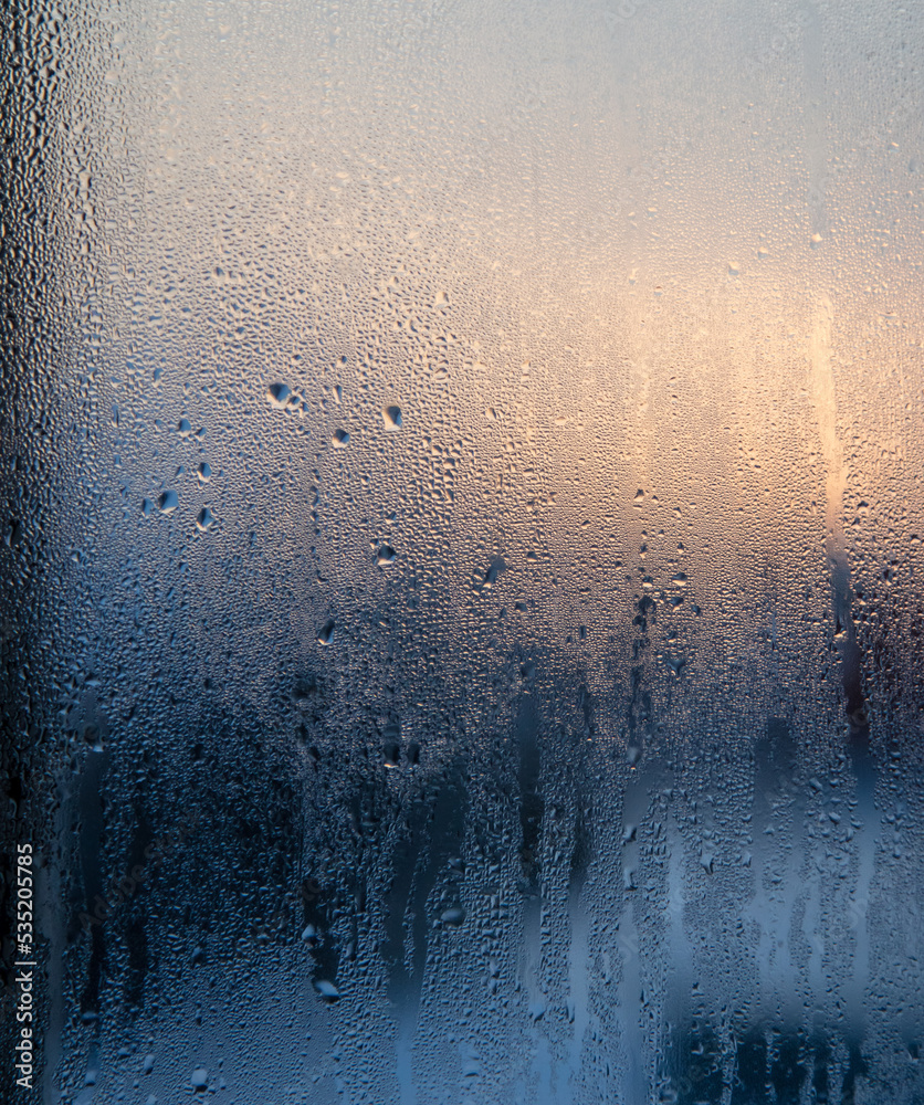 Misted window glass at sunrise. Stock Photo | Adobe Stock