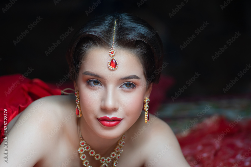 Beautiful portrait pretty woman red dressed as an Indian sexy girl with ...