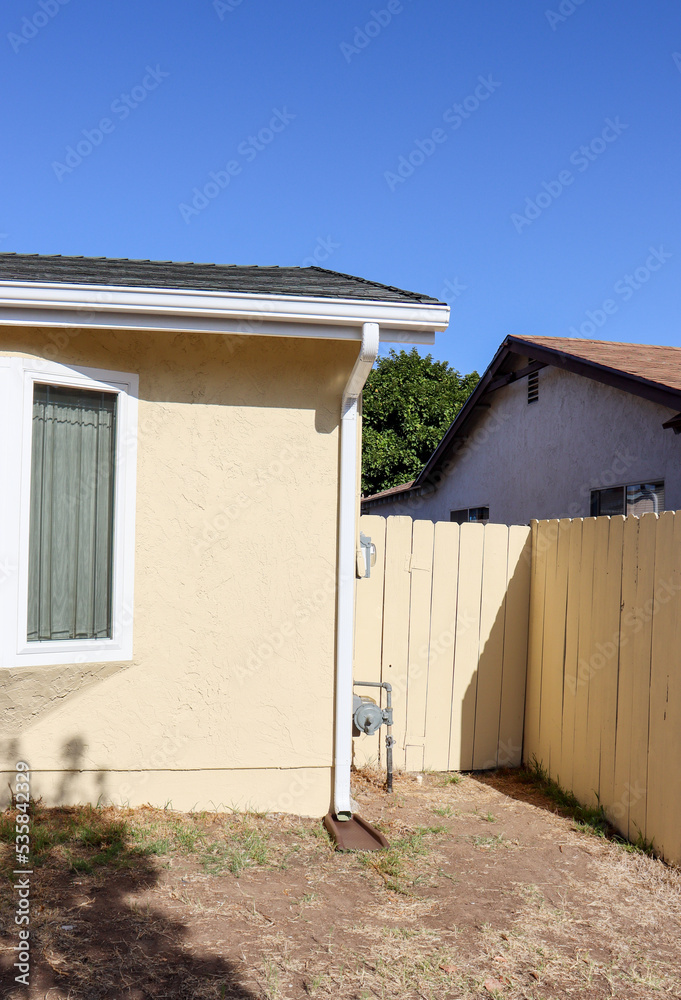 Rain gutter with downspout and water splash block . Stock Photo | Adobe ...