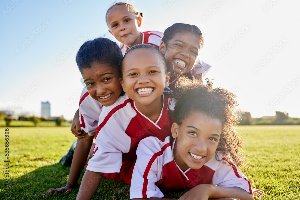 Girl, soccer and team portrait smile on grass together in sports field ...