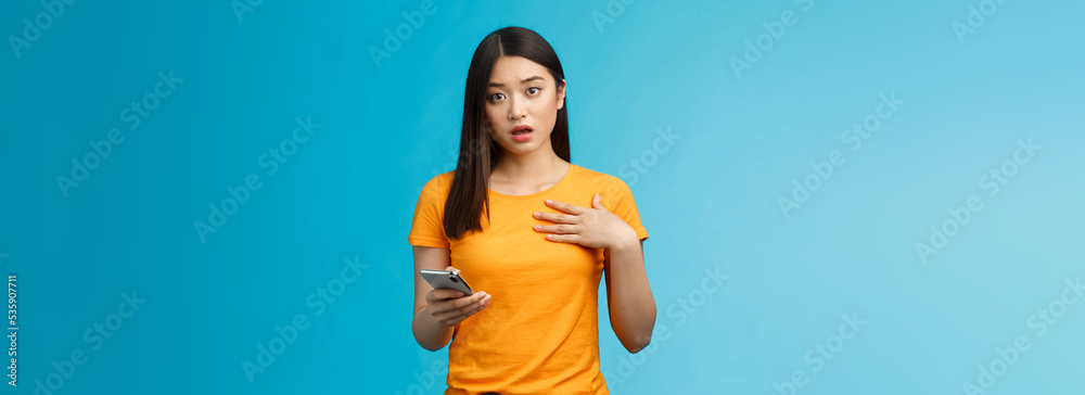 Offended shocked asian girl receive insulting message via internet ... Offended shocked asian girl receive insulting message via internet ...
