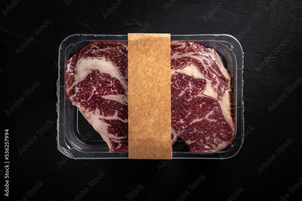 Beef steak in vacuum packaging. Template for meat packaging with an ...