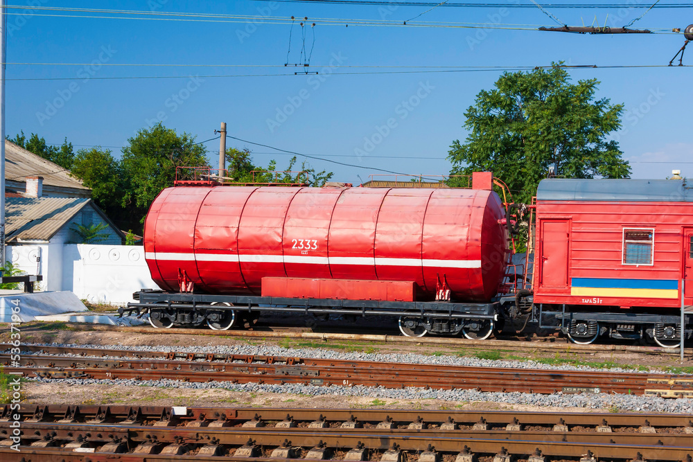 Red railway cistern for firefighting. Firefighting train, red tank with ...