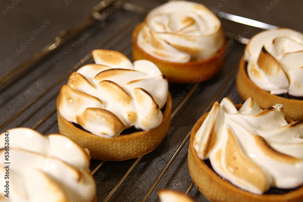 The tart cooking process, dessert in the oven, baking of tarts. Side ...