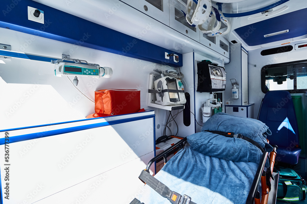 Foto EMS. Interior of ambulance with gurney, defibrillator and other medical equipment and ...