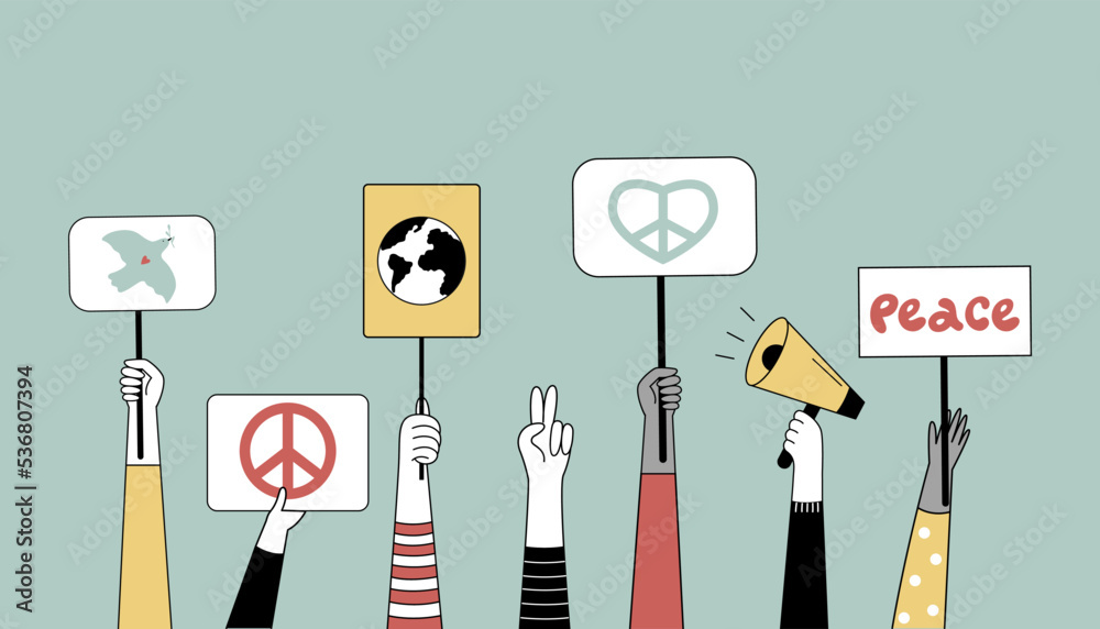 International Peace Day. Human hands are holding signs, banners, and ...