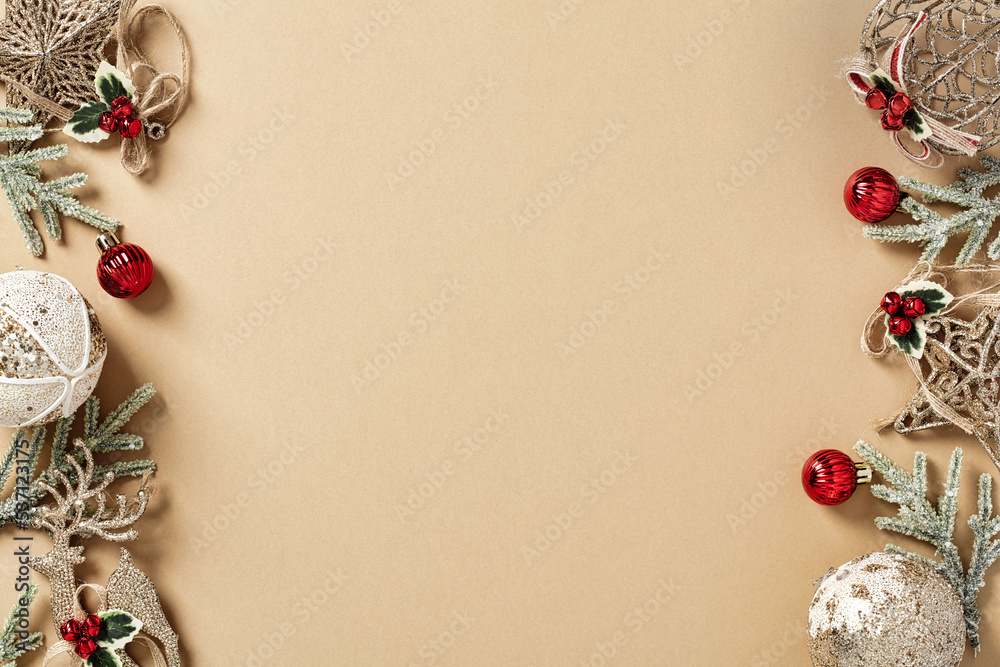 Beige Christmas background with fir tree branches and baubles ...