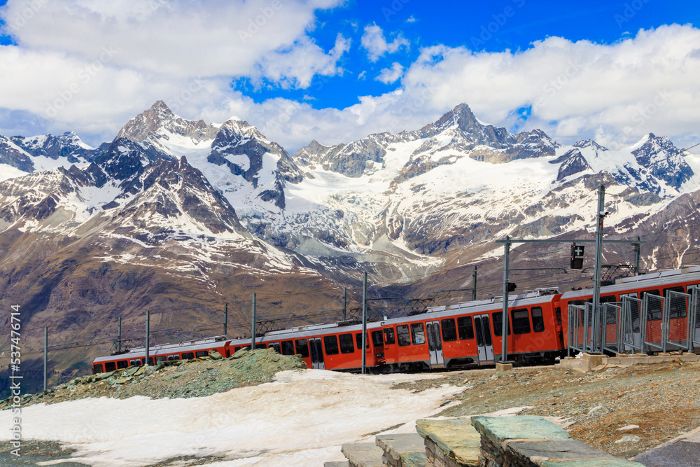 Beautiful view of the Swiss Alps with cogwheel train of Gornergrat ...