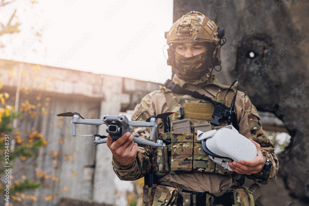 Modern army soldiers using aerial drone for artillery guidance and ...